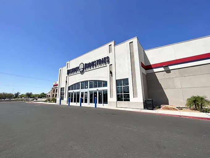 The gleaming white facade of Deseret Industries stands like a temple to thrift shopping, promising air-conditioned treasure hunting under the relentless Arizona sun.