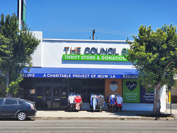 The Council Shop's welcoming facade promises treasure hunting adventures with racks of clothing already tempting passersby on Magnolia Boulevard. 