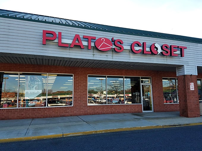 A welcoming storefront that promises fashion salvation for your wallet—brick, glass, and endless possibilities await inside.