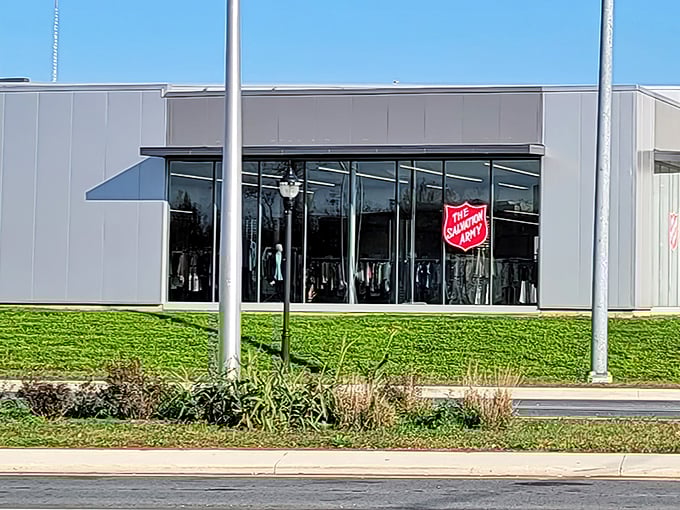The sleek exterior of Wilmington's Salvation Army Thrift Store beckons with its iconic red shield logo—a modern treasure chest disguised as a retail space.