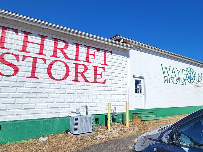 The white brick building with bold red lettering announces itself without pretense – treasure hunting starts here at Waypoint Thrift Store.