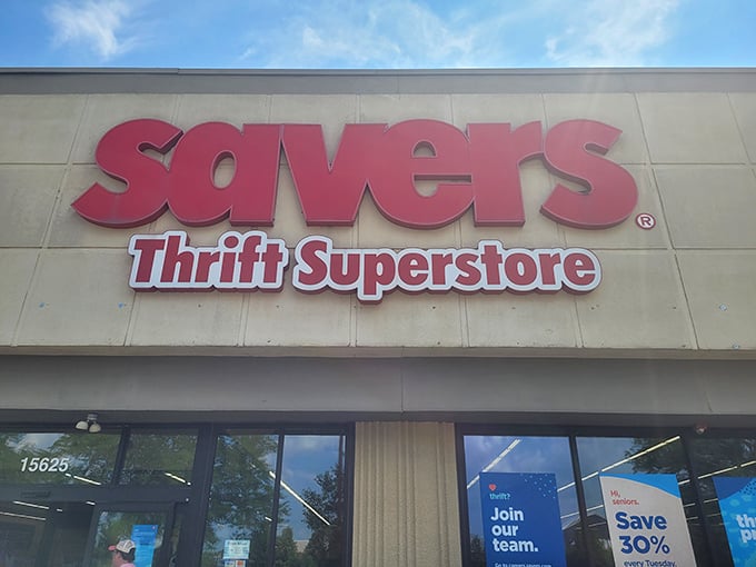 The bold red Savers sign beckons like a lighthouse for bargain hunters. This isn't just shopping—it's a treasure hunt with fluorescent lighting.