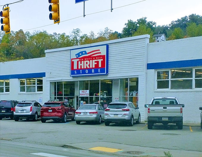 The patriotic facade of Red White & Blue Thrift Store stands as a monument to bargain hunting in Pittsburgh, where treasures await behind those unassuming doors.