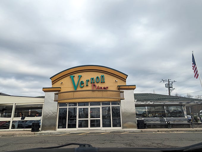 Even on cloudy days, the Vernon Diner's distinctive yellow and teal signage promises sunshine in the form of comfort food classics.