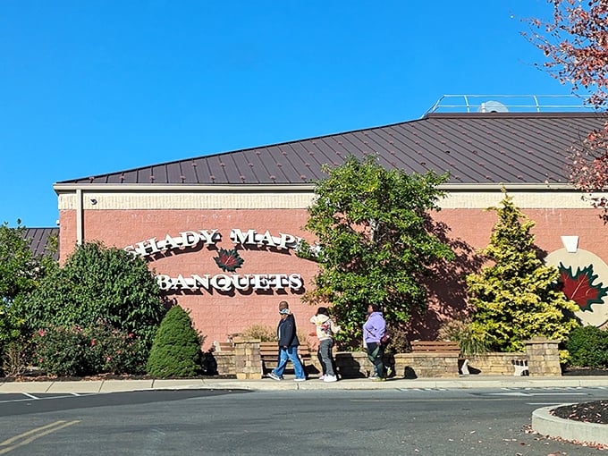The Shady Maple Banquets entrance stands like a culinary embassy in Pennsylvania Dutch Country, promising diplomatic relations between you and exceptional comfort food.