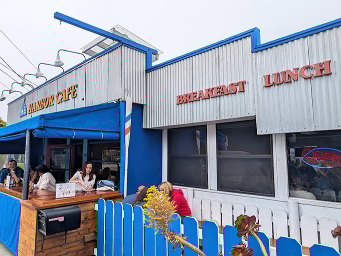 Harbor Cafe's cheerful blue exterior stands like a beacon of breakfast hope against the Santa Cruz sky, promising culinary adventures within.