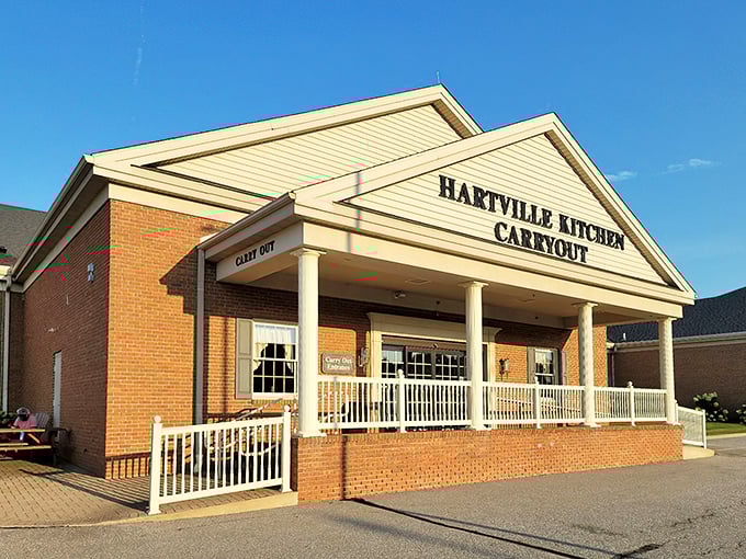 That classic brick facade with white columns whispers "serious comfort food lives here, folks."