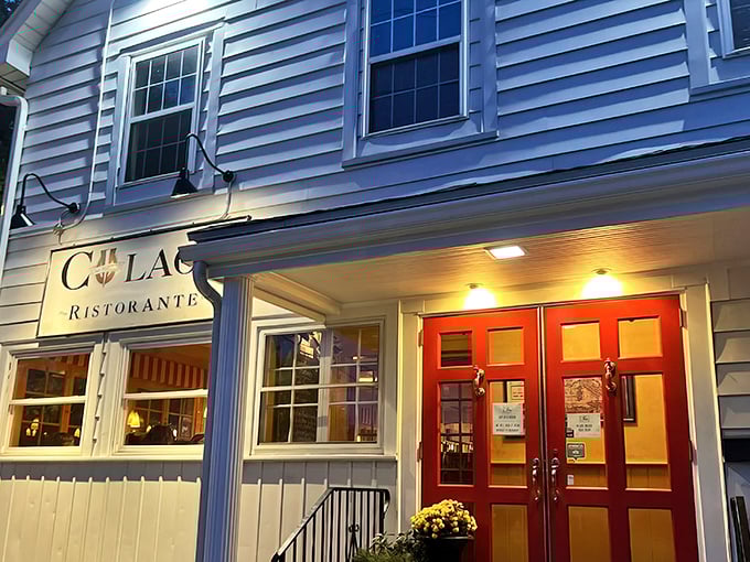 The charming white exterior of Colao's with its vibrant red door isn't just inviting—it's practically Italian for "get in here and eat something wonderful."