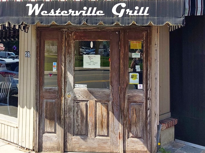 The weathered wooden door of Westerville Grill stands like a portal to comfort food nirvana, beckoning hungry travelers with unpretentious charm.