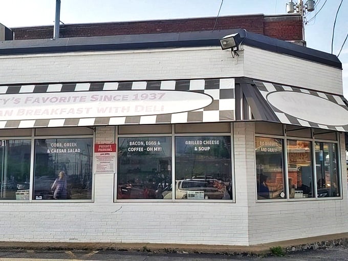The classic black-and-white checkered awning isn't just decoration—it's a beacon of breakfast hope for hungry Kansas Citians seeking their morning salvation.