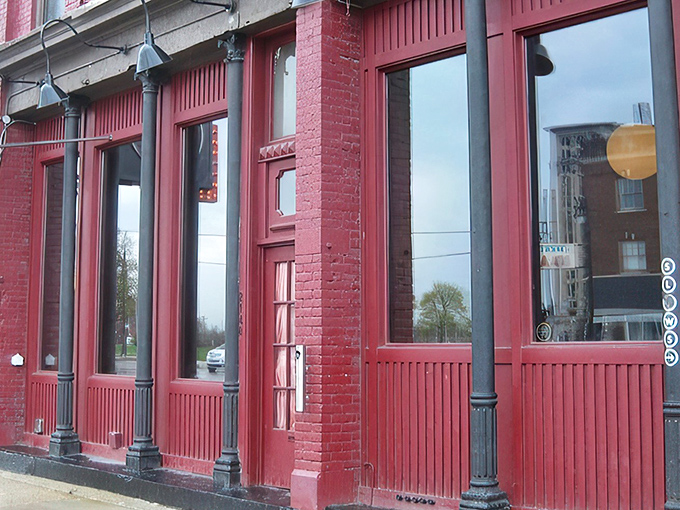 The crimson facade of Slows isn't just a building—it's a beacon for barbecue pilgrims seeking smoky salvation in Detroit's Corktown neighborhood.