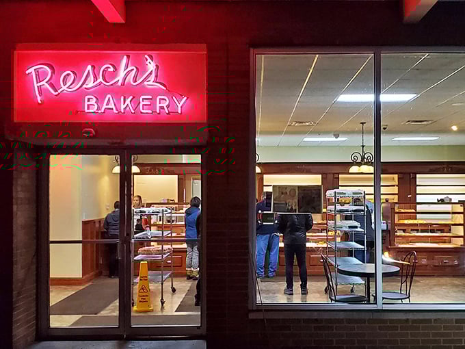 That iconic red neon sign beckons like a lighthouse for carb-lovers, promising sweet salvation after a long day. No filter needed on deliciousness.