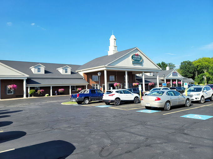 The stately exterior of Hartville Kitchen welcomes hungry travelers with its distinctive cupola and covered entrance—Americana architecture at its most appetizing.