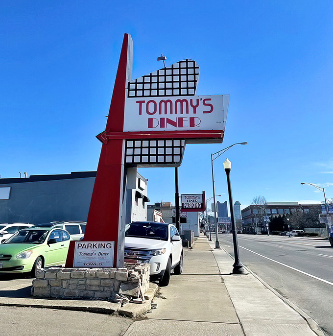 That iconic red and white sign isn't just announcing a diner—it's promising a time machine to when breakfast was an art form and calories didn't count.