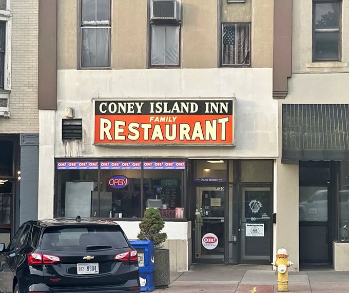 The iconic red and black sign of Coney Island Inn stands as a beacon of affordable comfort food in downtown Mansfield. Some landmarks don't need neon to shine.
