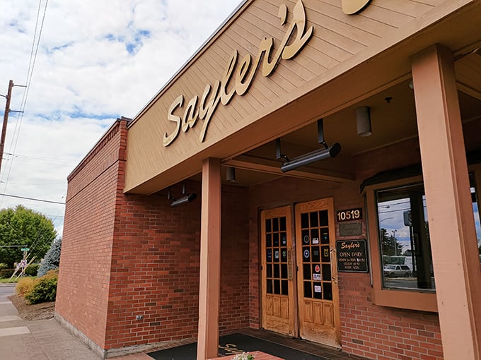 That unmistakable yellow script against brick says everything you need to know: serious steaks await inside. No frills, no fuss, just decades of meaty perfection.