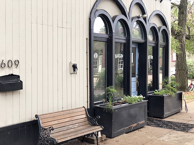 The charming façade with its distinctive arched windows and planters feels like stumbling upon a secret European bakery tucked away in a Pittsburgh neighborhood.