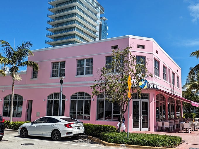 Miami Beach's most eye-catching landmark isn't a celebrity—it's a building that looks like it was dipped in Pepto-Bismol. Gloriously unapologetic!