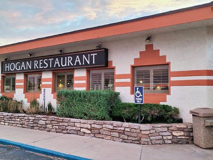 That coral-striped exterior isn't trying to impress anyone – and that's exactly why it does.