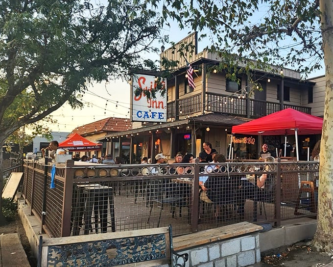 Where nostalgia meets appetite – Swing Inn's outdoor patio offers the perfect perch for people-watching while debating between the country fried steak or BBQ ribs.