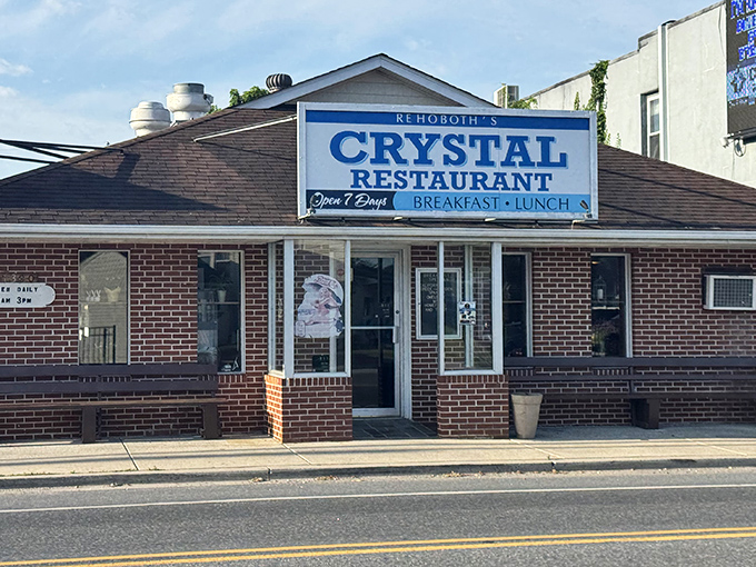 The unassuming brick façade of Crystal Restaurant stands as a beacon of breakfast hope on Rehoboth Avenue, promising honest food without the fanfare.