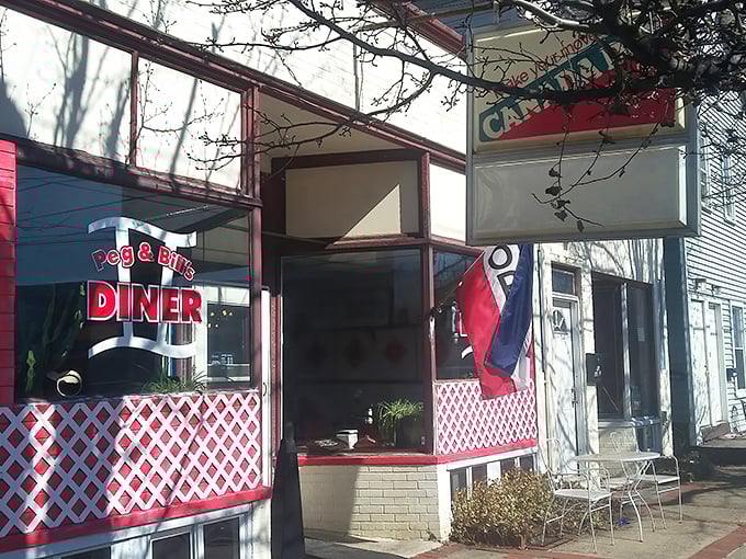 The classic red and white lattice exterior of Peg & Bill's isn't trying to be retro-cool—it's the real deal, a genuine roadside treasure in Cogan Station.