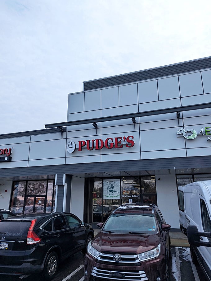The iconic red Pudge's sign welcomes hungry visitors like a beacon of sandwich salvation in Blue Bell's suburban landscape.