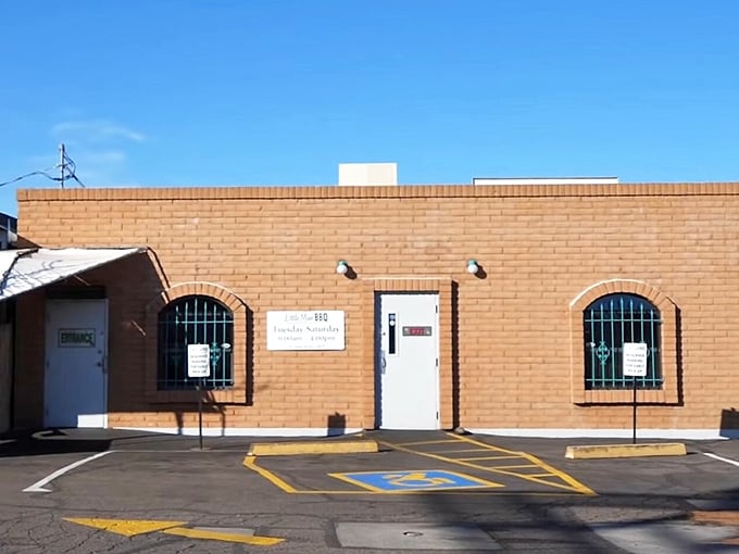 The unassuming brick exterior belies the culinary magic happening inside. Like finding a Picasso at a yard sale, this modest building houses barbecue greatness.