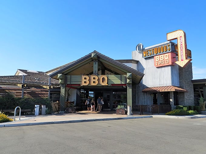 This rustic facade promises serious barbecue business – where corrugated metal meets carnivorous dreams in perfect harmony.