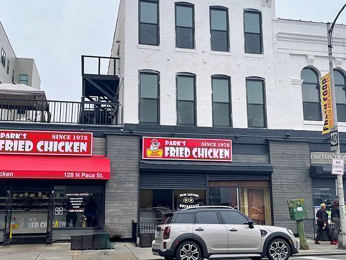 The unassuming storefront of Park's Fried Chicken stands like a beacon of culinary promise on North Paca Street, its bold red signage a siren call to fried chicken aficionados.