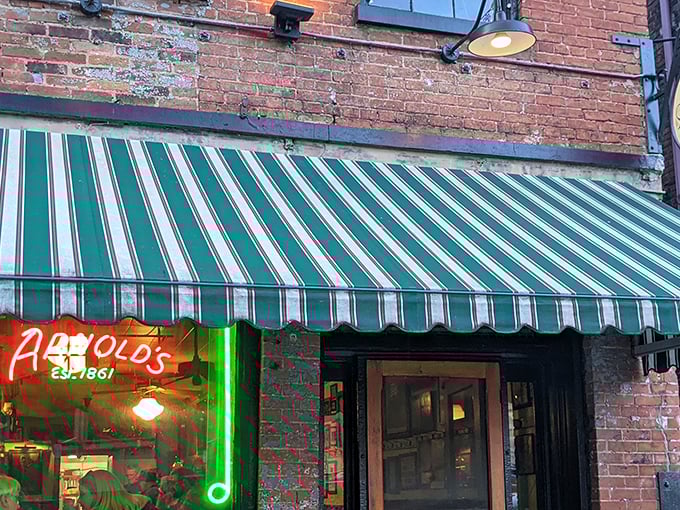 That iconic neon sign under the green and white awning isn't just advertising – it's a beacon of culinary hope in downtown Cincinnati.