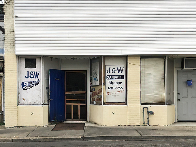 That blue door isn't just an entrance—it's a portal to sandwich nirvana. No fancy signage needed when what's inside speaks volumes.