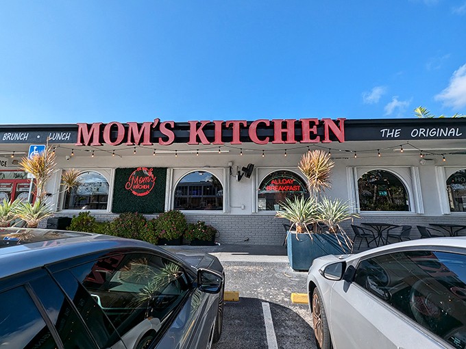 The red letters beckon like an old friend: "Mom's Kitchen" – where breakfast dreams come true and diet plans go to die.