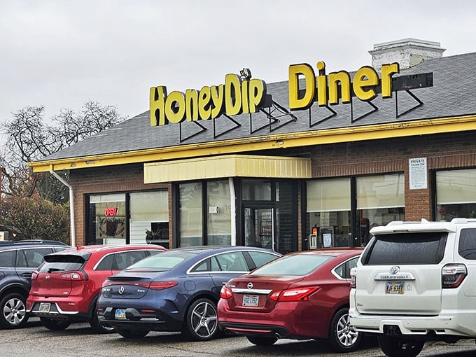 The bright yellow sign of Honey Dip Diner stands out like a breakfast beacon, promising comfort food salvation to hungry Columbus souls.