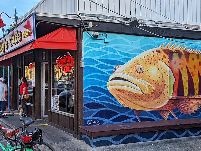 That giant grouper mural isn't just art – it's a promise of what's waiting inside this beach treasure.