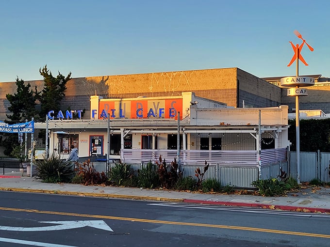 The golden hour glow on Rudy's Can't Fail Cafe feels like California sunshine bottled up in neon letters and white stucco.
