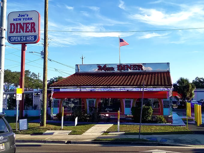 That iconic sign promises "24 HRS" of comfort food possibilities, standing tall against the Tampa sky like a beacon for the breakfast-obsessed.