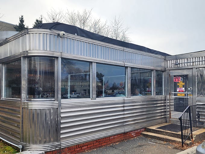 The gleaming stainless steel exterior of Frost Diner isn't trying to be retro—it's authentically vintage, a shiny time capsule serving comfort on Route 29.