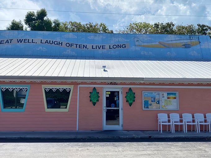 The coral-colored exterior of Mrs. Mac's Kitchen stands out like a cheerful greeting card against the Florida Keys sky. "Eat Well, Laugh Often, Live Long" indeed!