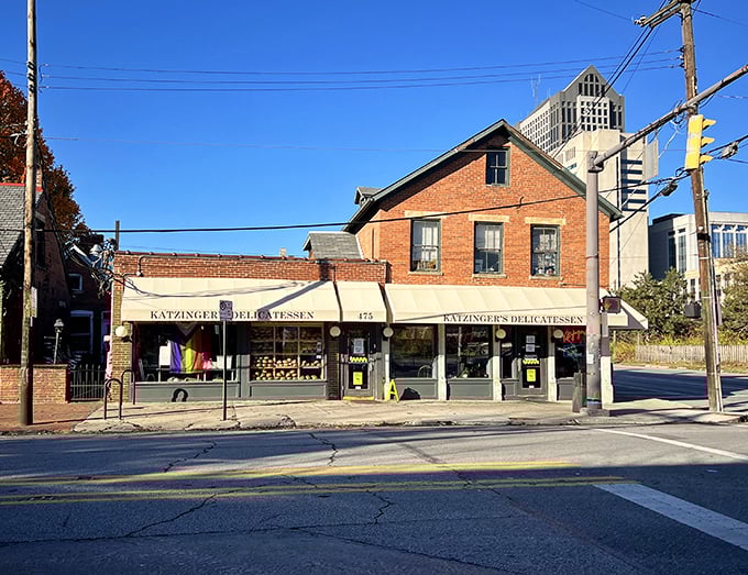 Morning light bathes Katzinger's historic building, where the city skyline serves as backdrop to countless delicatessen dreams fulfilled daily.