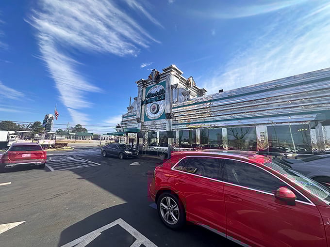 The gleaming chrome exterior of Marietta Diner stands like a time-traveling spaceship that landed in Georgia with one mission: delivering comfort food that defies gravity.