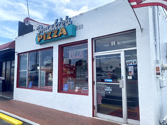 That iconic turquoise and yellow sign has been beckoning hungry Miamians for generations – a beacon of square pizza perfection on Bird Road.