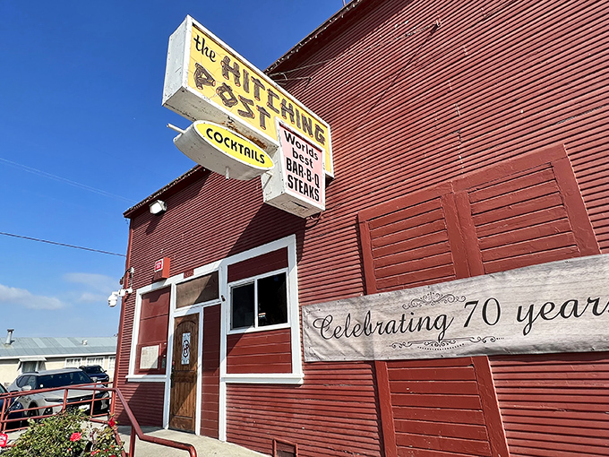 The iconic red exterior of The Hitching Post stands like a time capsule in Casmalia, proudly announcing its 70-year legacy of culinary magic.