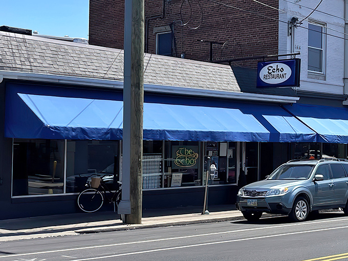 The blue awnings of The Echo beckon like an old friend on Edwards Road, promising comfort food and conversations that matter.