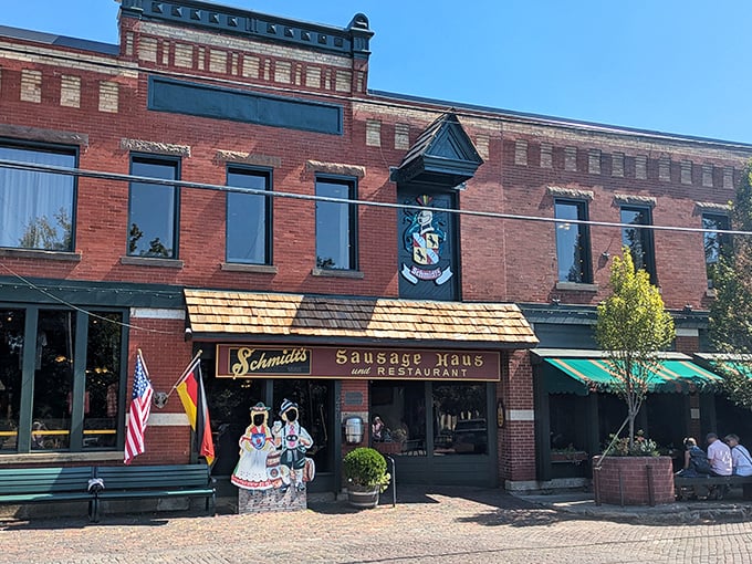 The iconic brick façade of Schmidt's welcomes hungry visitors with its vintage sign and wooden shingles—like a time portal to old-world Bavaria in Columbus.