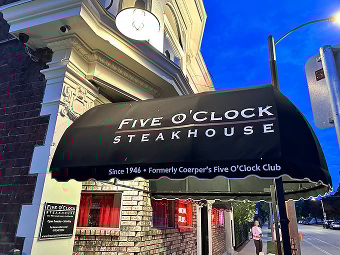 That iconic black awning might as well read "Abandon Diets, All Ye Who Enter Here" – the first sign you're about to experience Milwaukee's legendary steakhouse tradition.