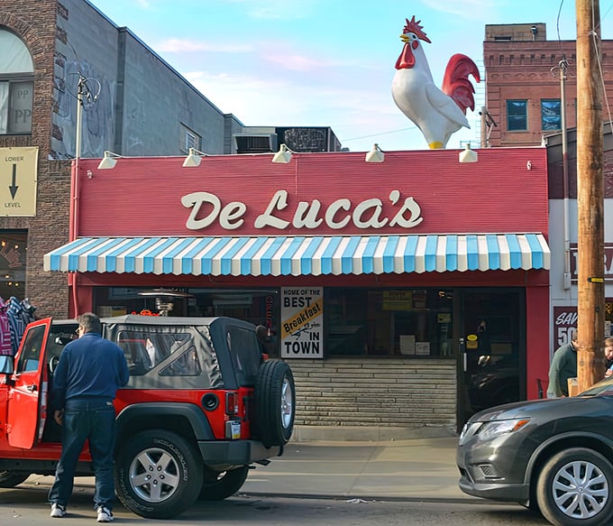 The iconic rooster stands guard atop DeLuca's red storefront, a breakfast beacon that's been calling hungry Pittsburghers to the Strip District for generations.