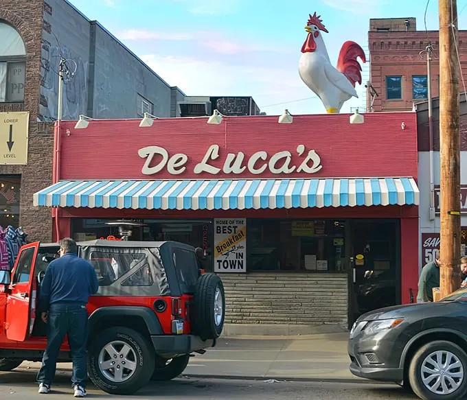The iconic rooster stands guard atop DeLuca's red storefront, a breakfast beacon that's been calling hungry Pittsburghers to the Strip District for generations.
