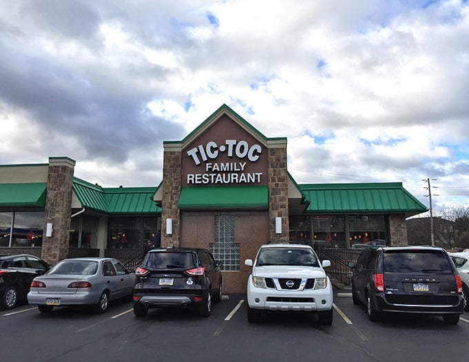The green-roofed sanctuary of comfort food stands like a beacon for hungry travelers. Tic-Toc's unassuming exterior hides culinary treasures waiting to be discovered.