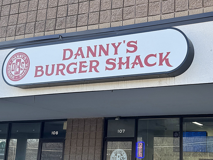 The unassuming storefront of Danny's Burger Shack stands like a beacon of hope for burger enthusiasts – no fancy frills, just a promise of greatness within.
